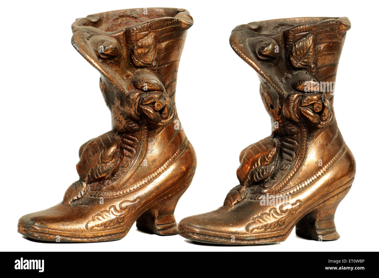 Handicraft metal shoes on white background ; India Stock Photo - Alamy