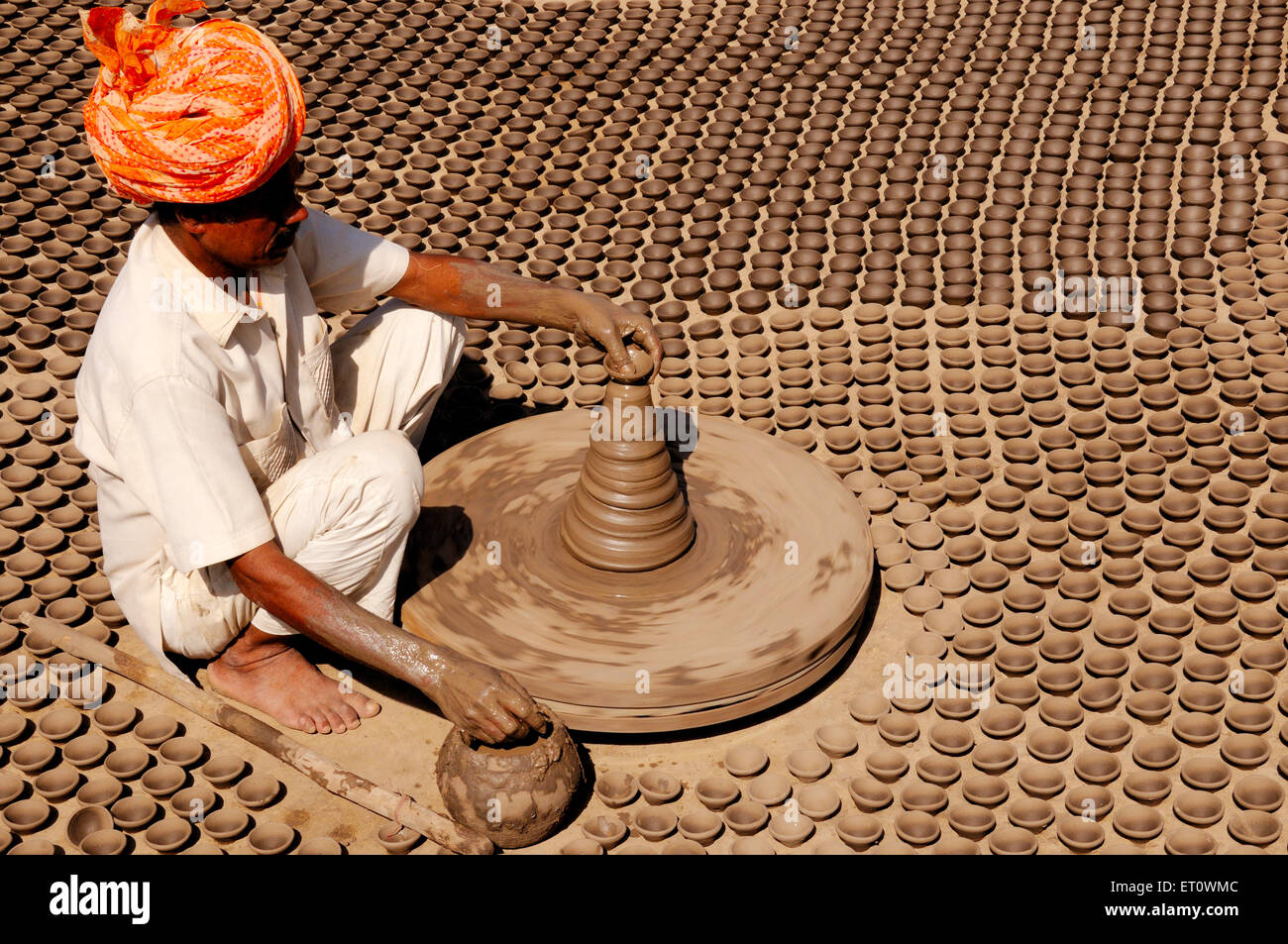 Potter making sand lamps on a potter wheel ; Jodhpur ; Rajasthan ...