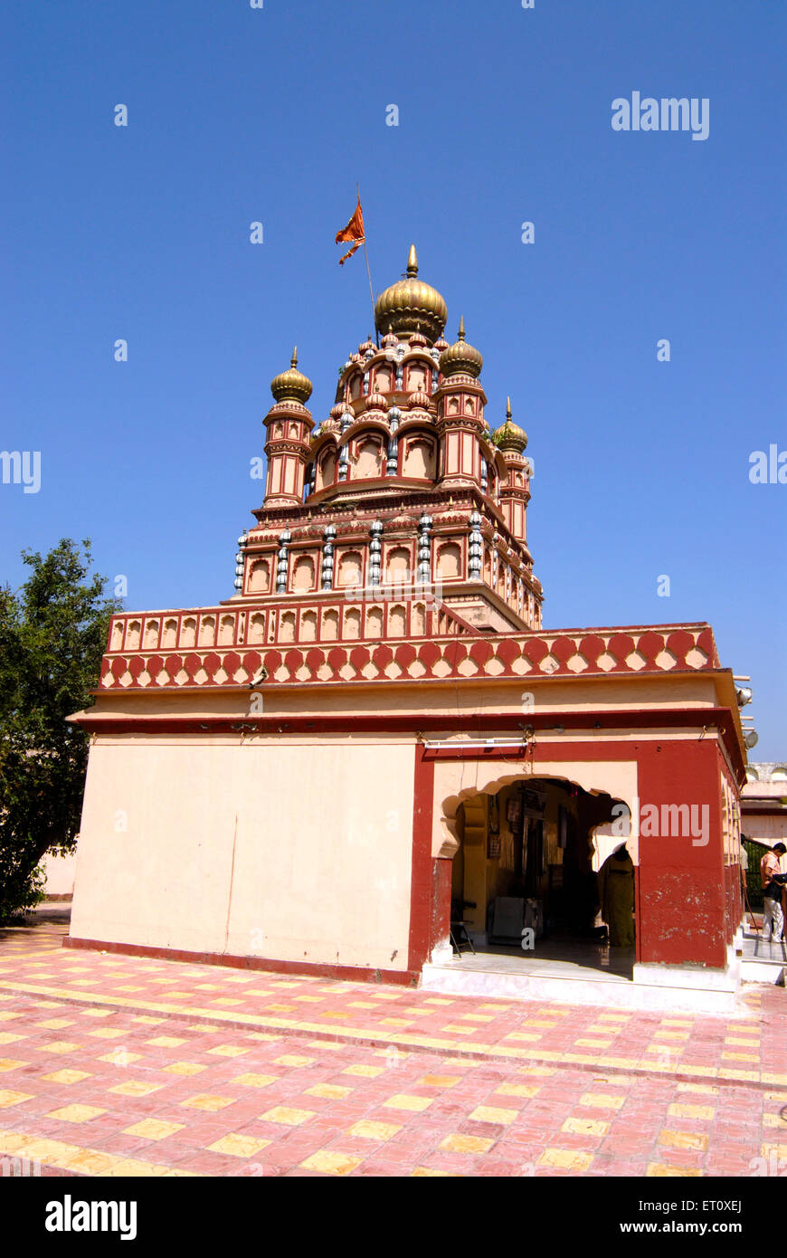 Orange color flag on temple hi-res stock photography and images - Alamy