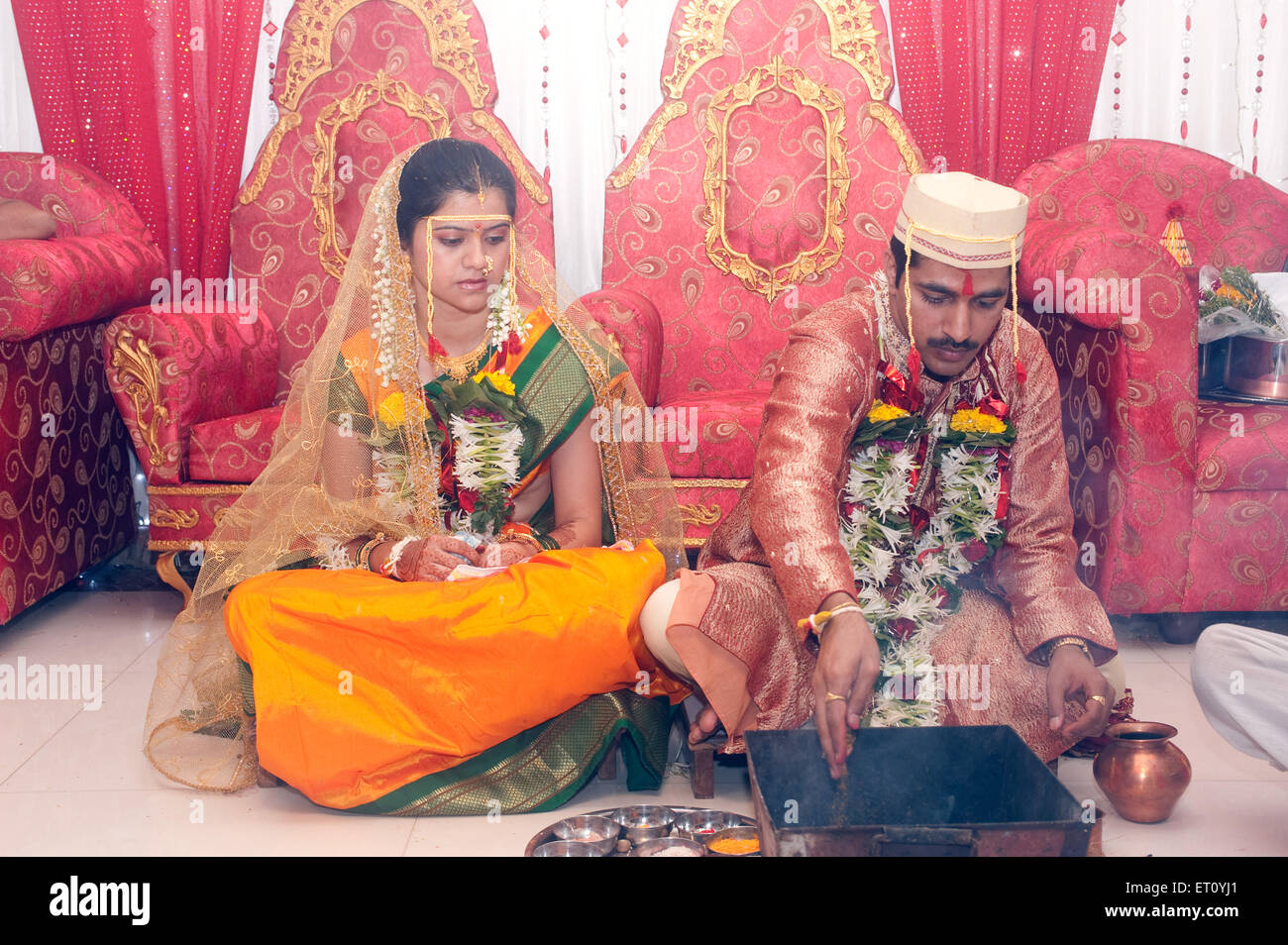 Bride and bridegroom sitting in marriage ceremony MR#778F Stock Photo ...