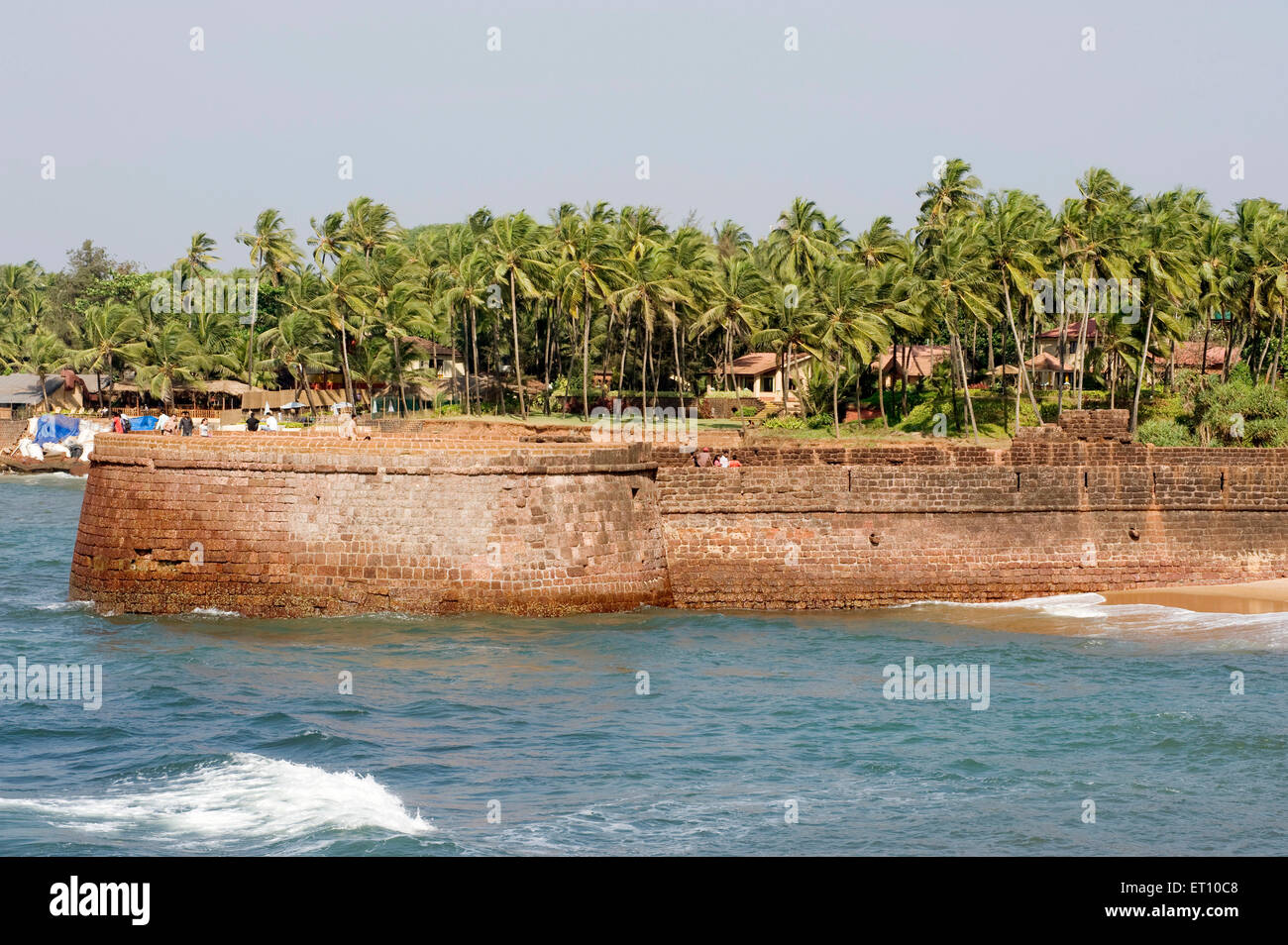 Lower fort aguada and dense coconut palms at sinquerim beach ; Goa ...