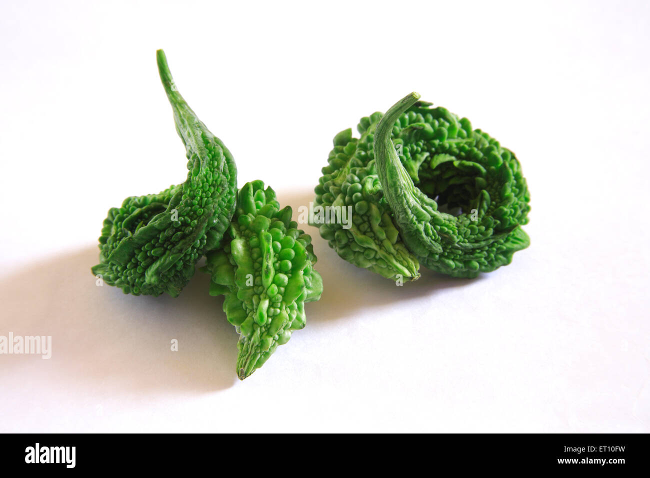 Green vegetable ; karela bitter gourd momordica charantia on white ...