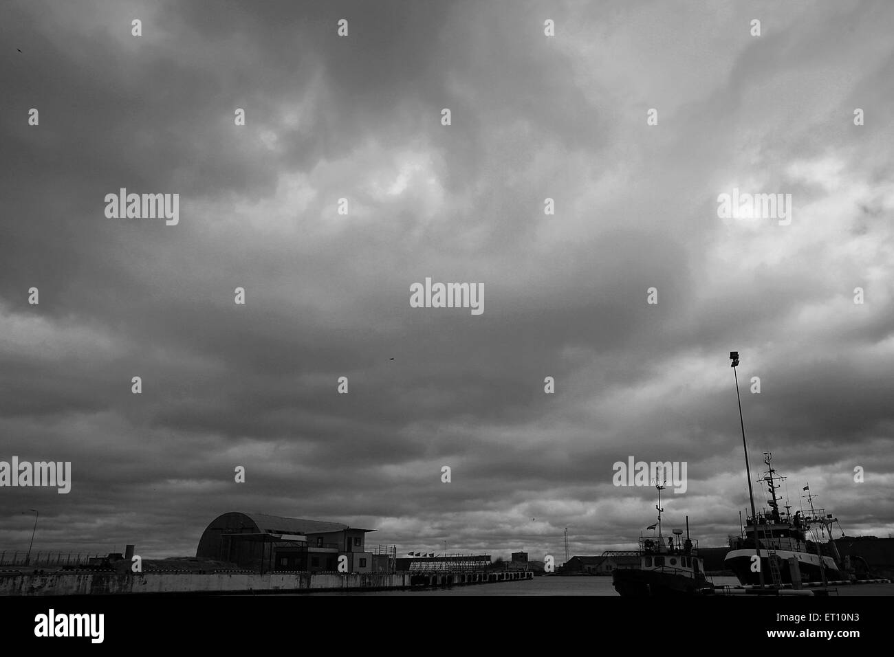 dramatic storm weather over harbor while sea boats staying here Stock ...