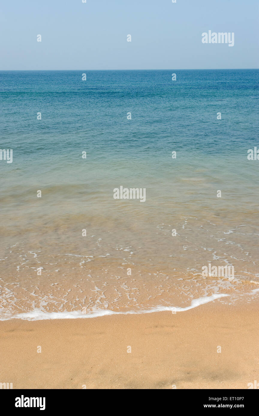 Sand and blue water of arabian sea at anjuna beach ; Goa ; India Stock ...