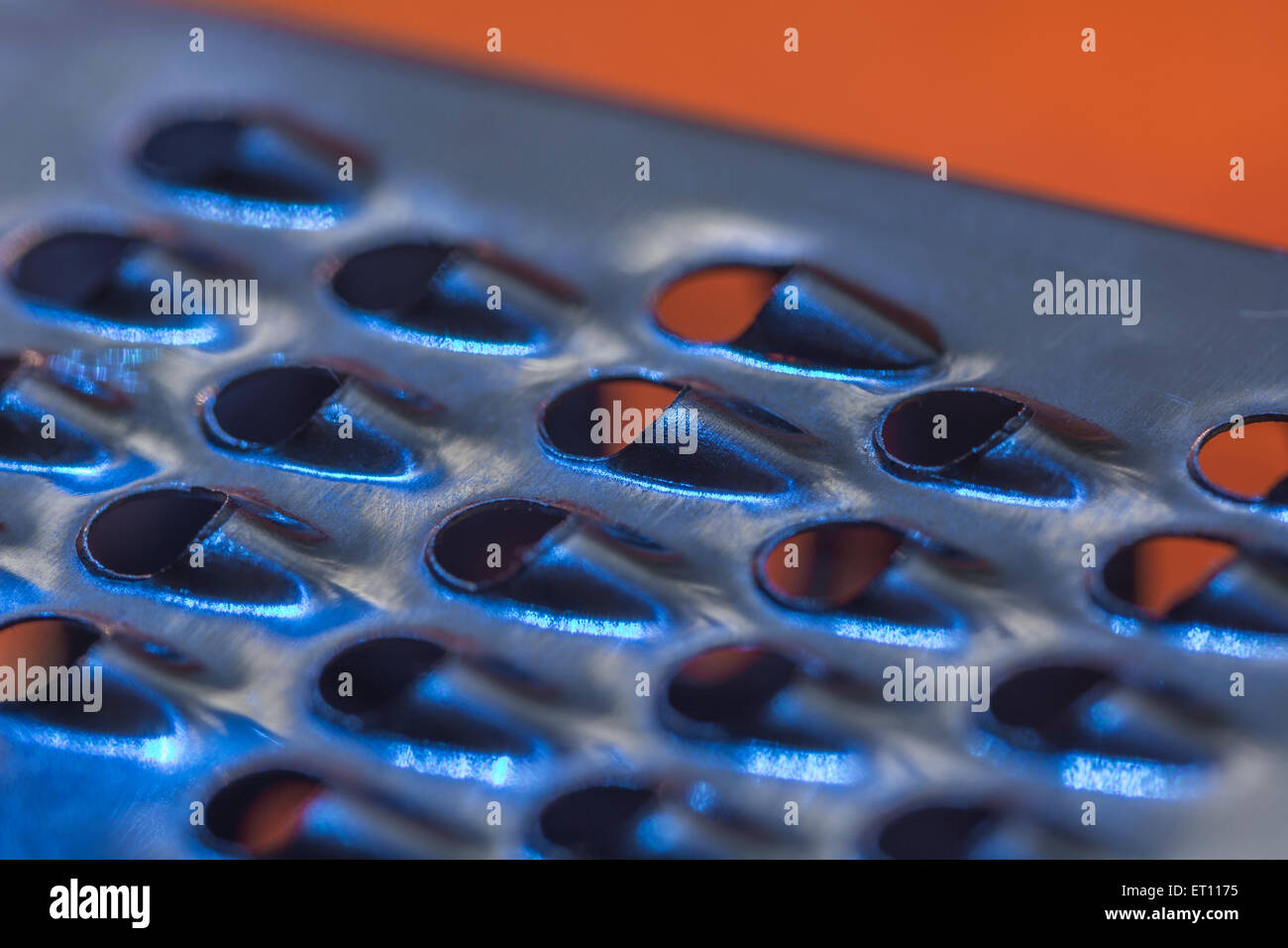 Macro-photo of a section on a mini cheese grater / hand grater / box ...