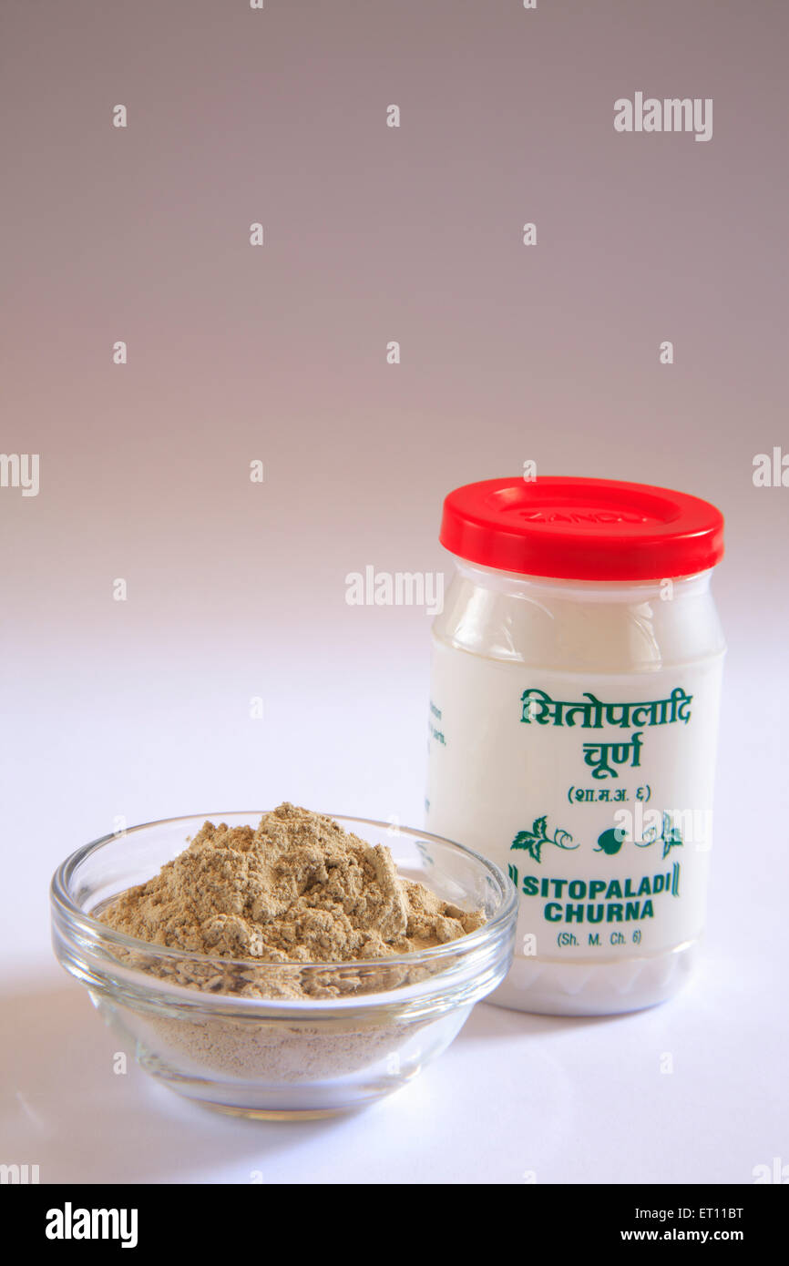 sitopaladi churna powder in plastic bottle and glass bowl on white ...