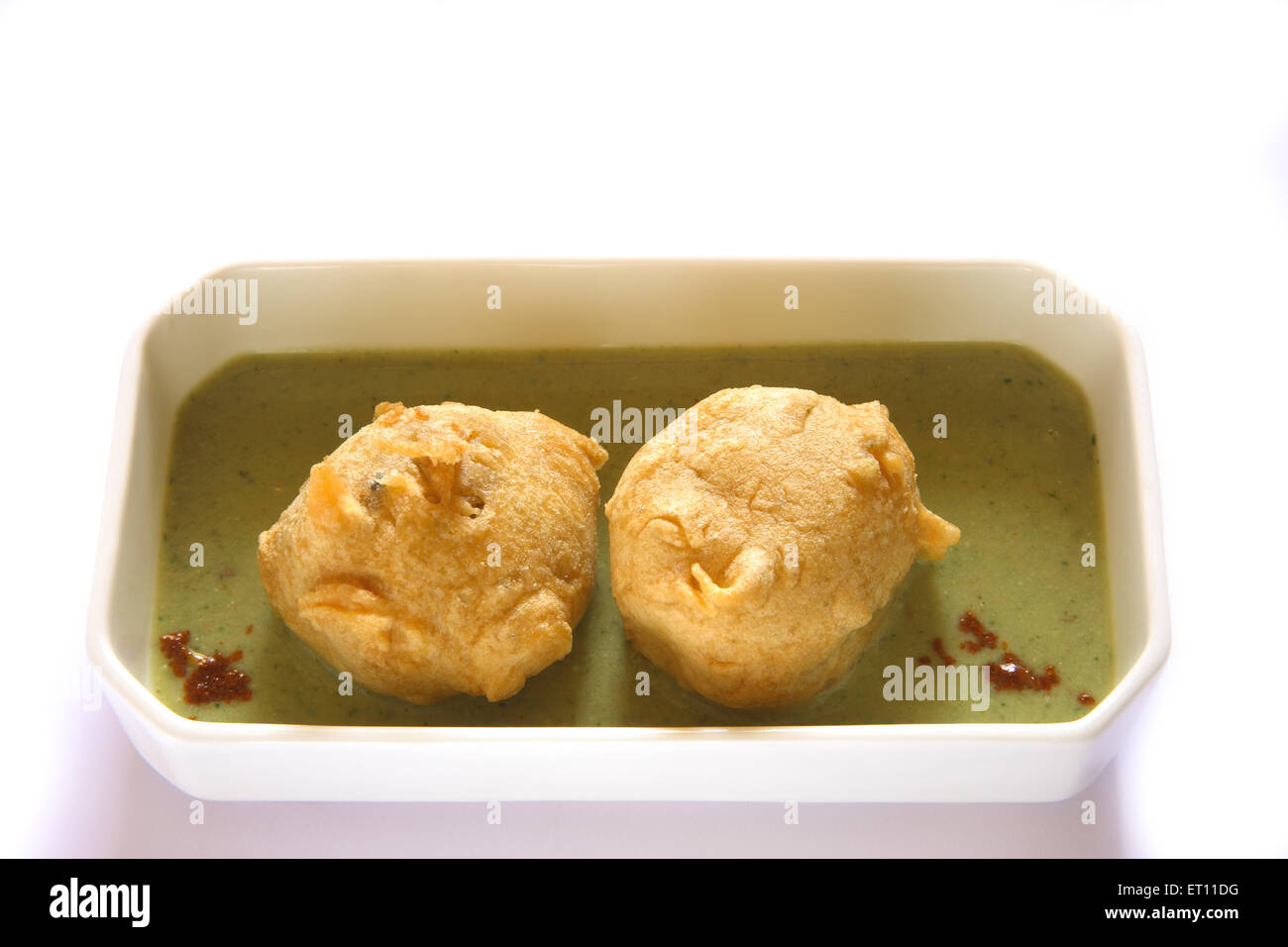 Fast food ; batata vada with chutney in tray on white background Stock ...