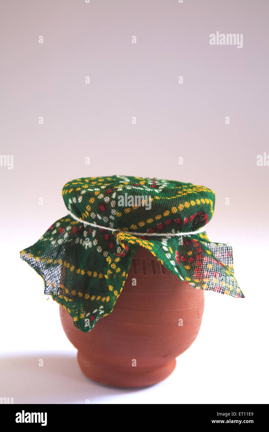 Buttermilk in earthen pot cover with cloth on white background Stock ...