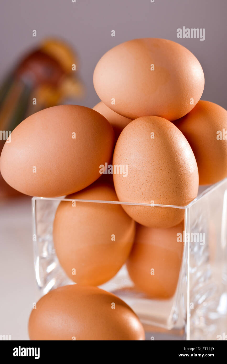 Brown Shell Eggs Stacked in a Square Glass-Terra Cotta Chicken in ...