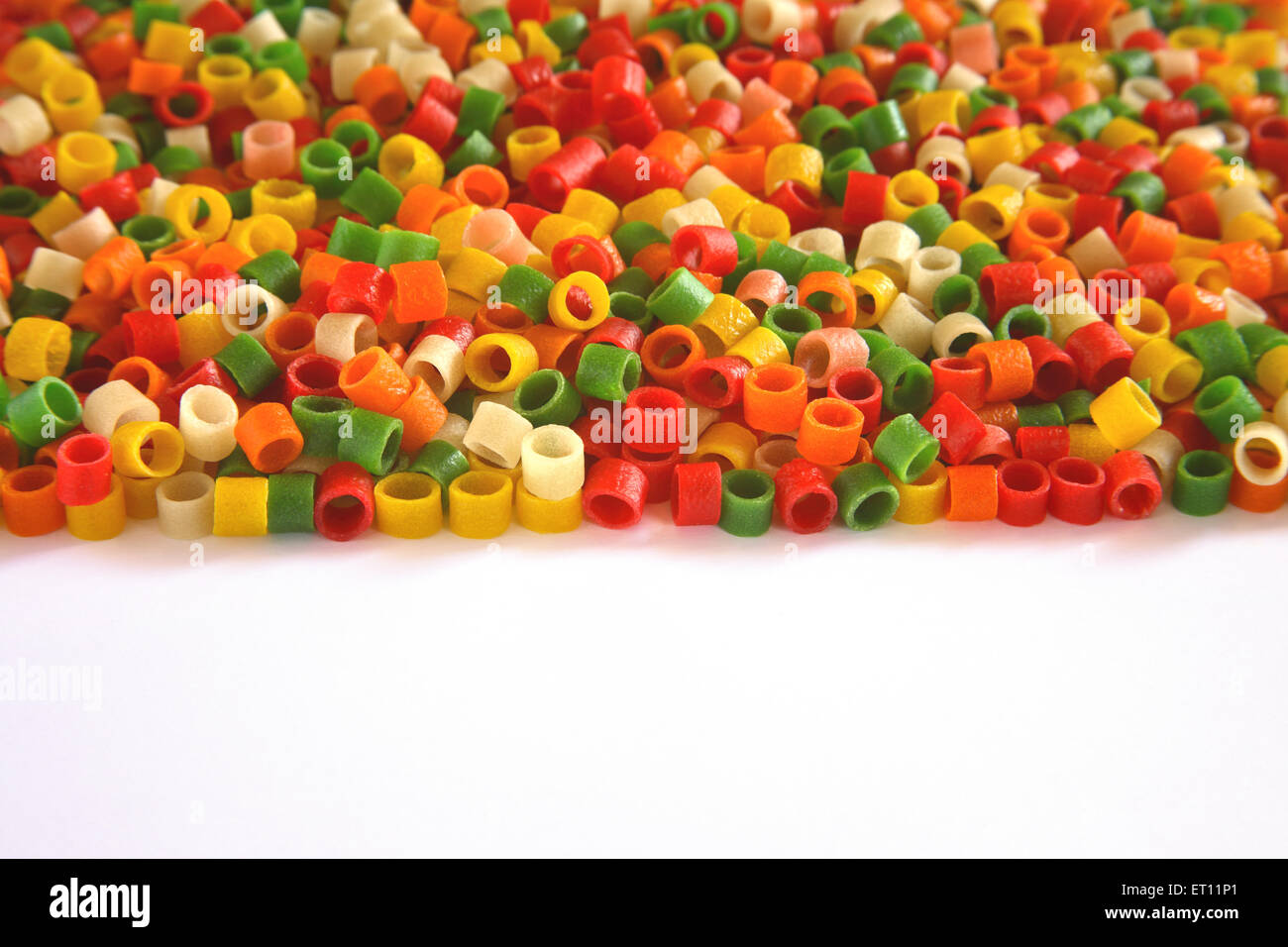 Colourful raw round chips on white background Stock Photo - Alamy