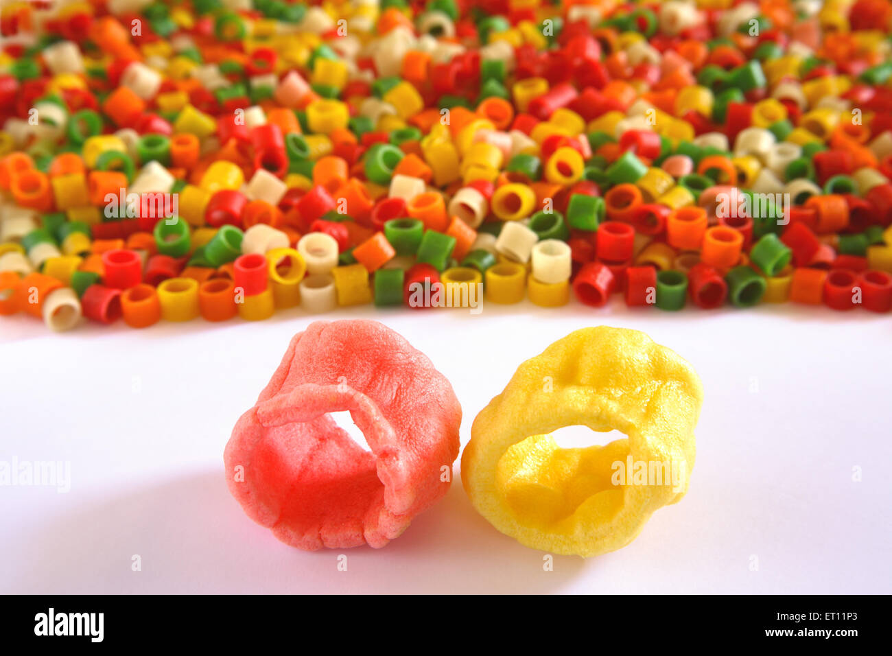 Colourful raw and fried round chips on white background Stock Photo - Alamy