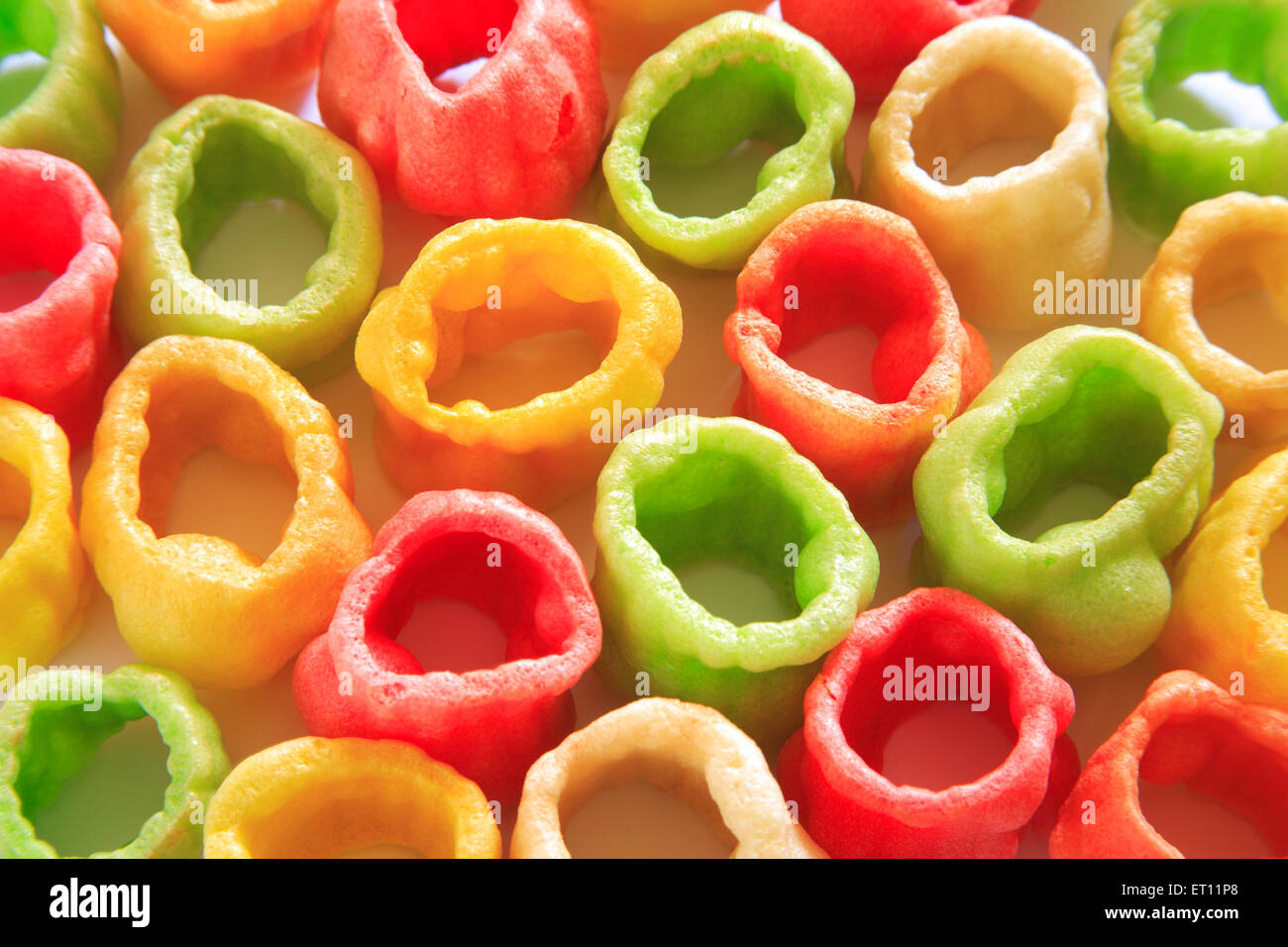 Colourful raw and fried round chips on white background Stock Photo - Alamy