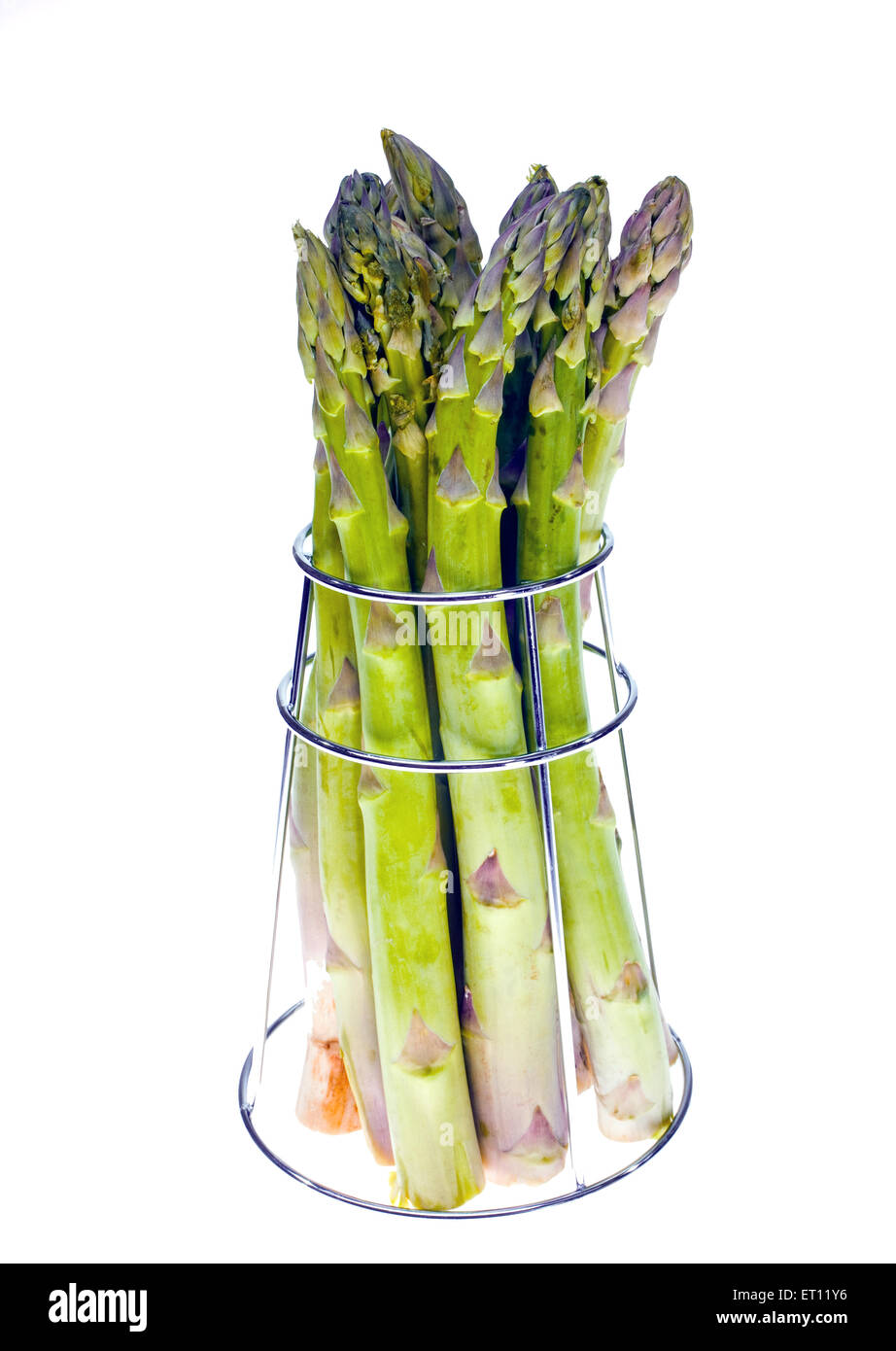 Raw asparagus upright in a metal steamer stand. White background Stock ...