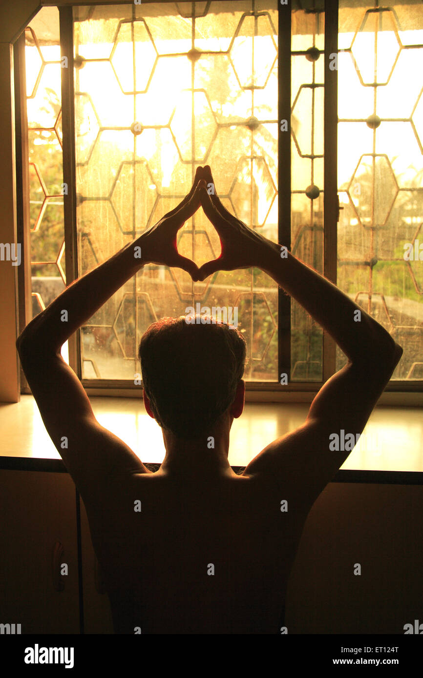 Man yoga exercise both hands above head - MR#201 Stock Photo - Alamy