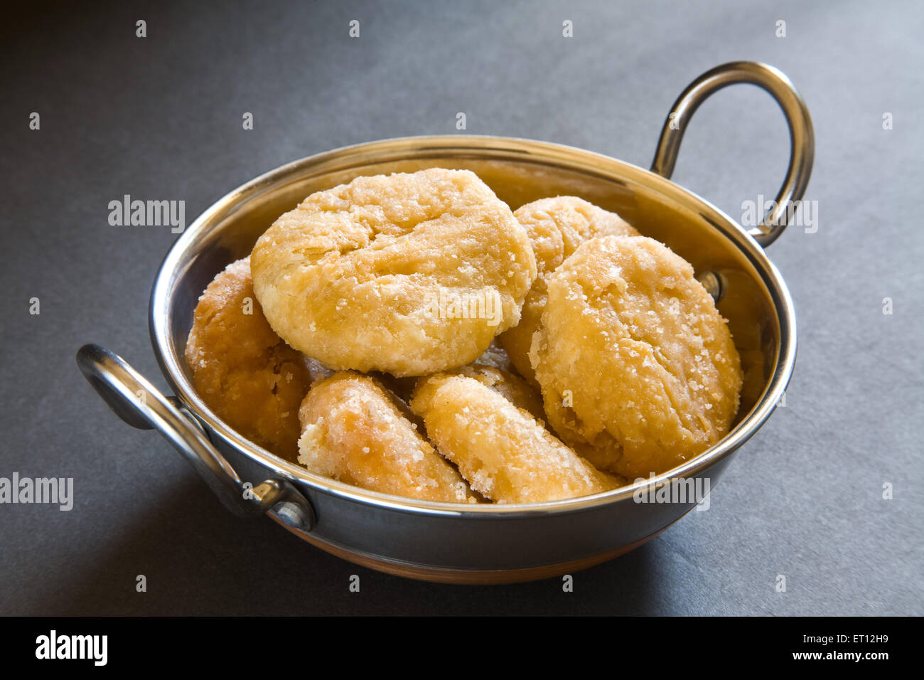 Indian sweet ghari ghaari in steel kadahi on black background 20 April ...