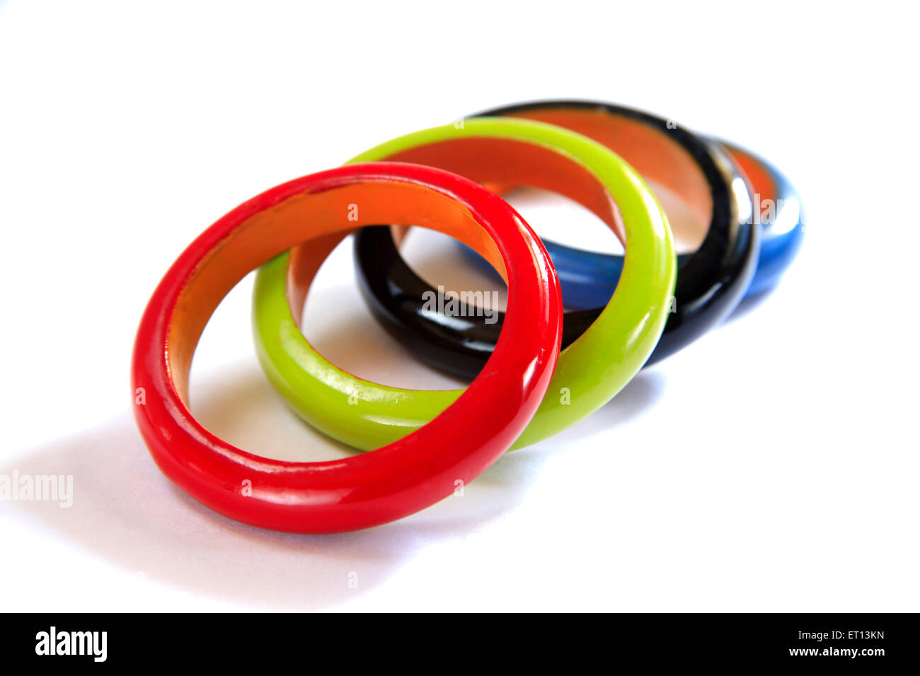 Colorful wooden bangles on white background Stock Photo - Alamy