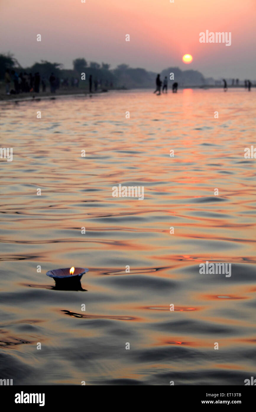 Diya offering to river ; Vautha ; Gujarat ; India Stock Photo - Alamy