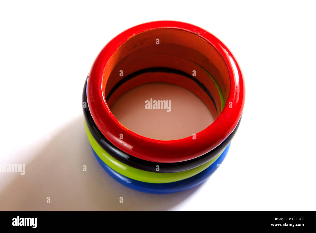 Colorful wooden bangles on white background Stock Photo - Alamy