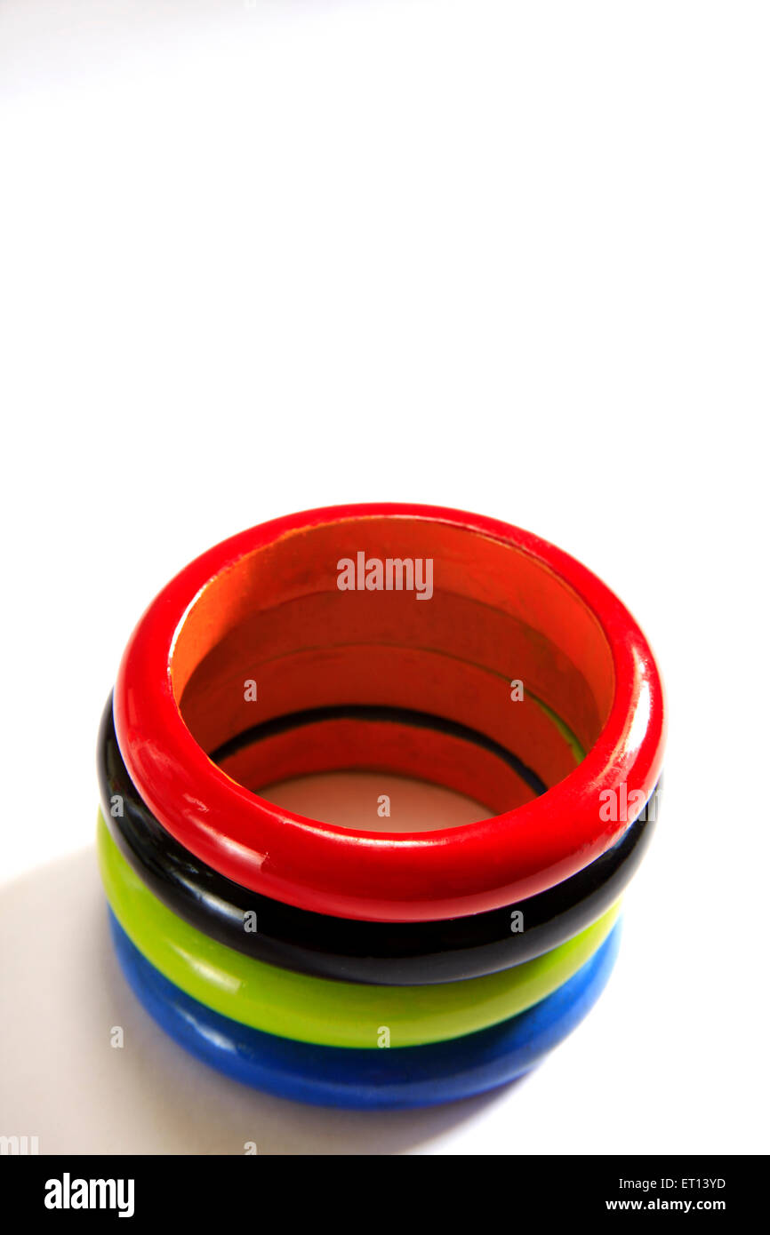 Colorful wooden bangles on white background Stock Photo - Alamy