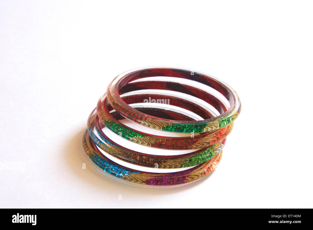 Colorful glass bangles on white background Stock Photo - Alamy