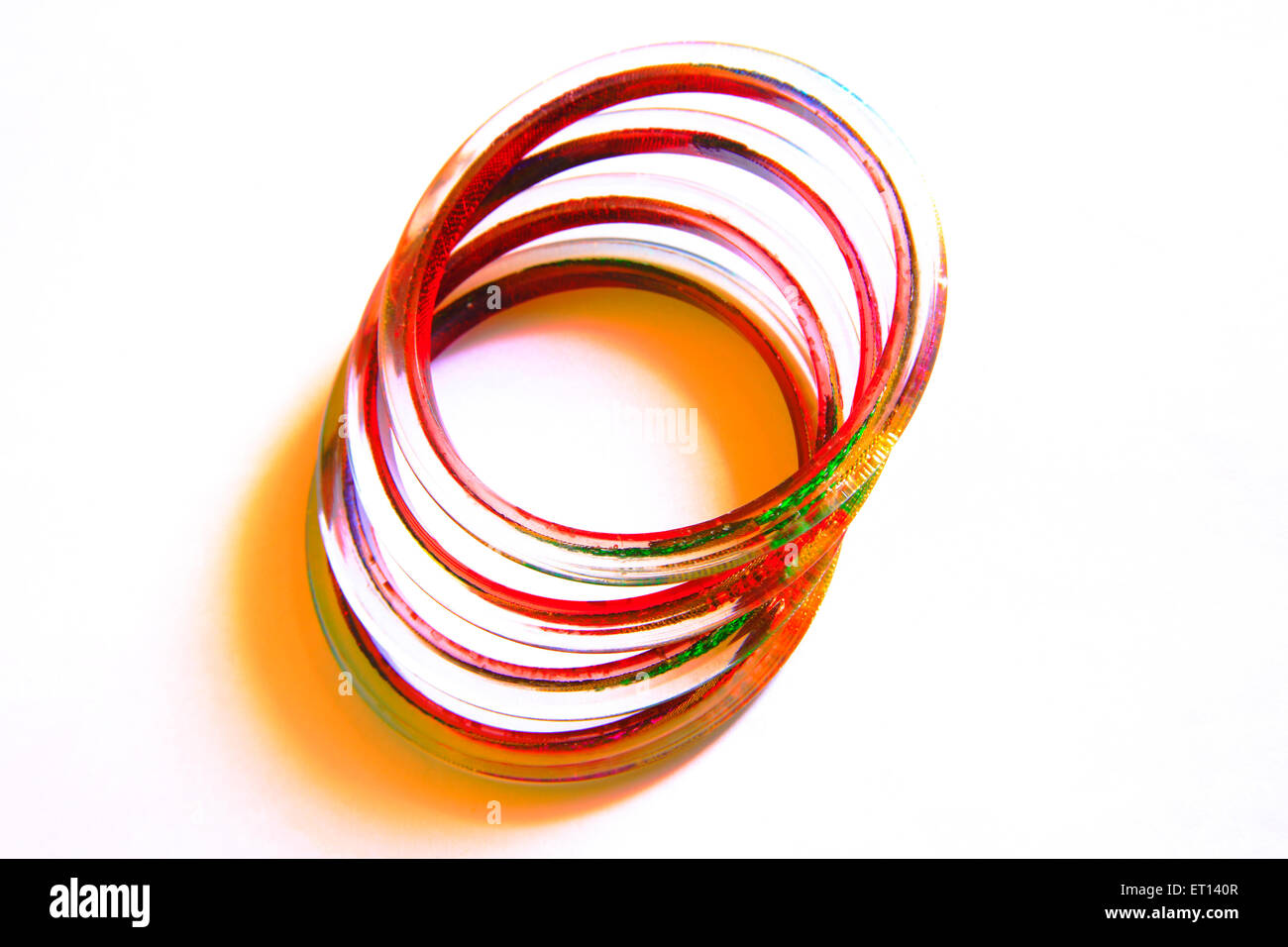 Colorful glass bangles on white background Stock Photo - Alamy