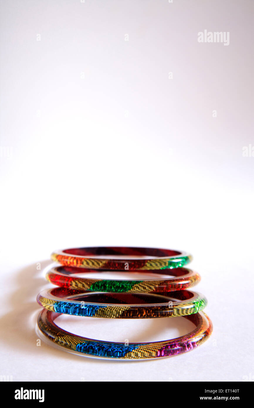 Colorful glass bangles on white background Stock Photo - Alamy