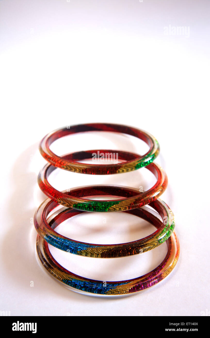 Colorful glass bangles on white background Stock Photo - Alamy