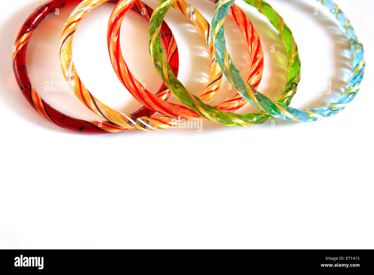 Colorful glass bangles on white background Stock Photo - Alamy