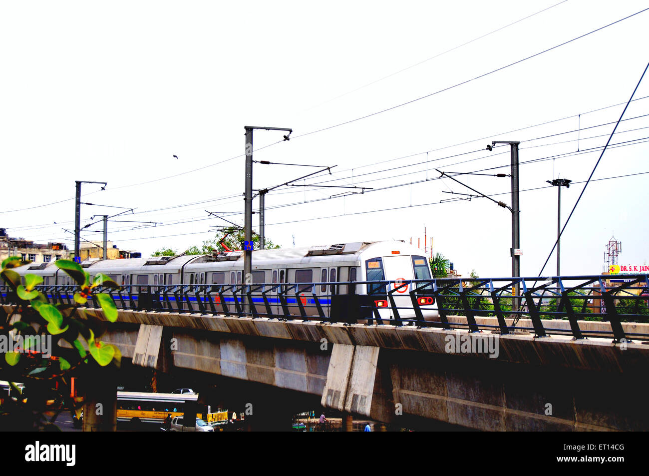 Metro train on bridge at junction of Panchkuan oad ; New Delhi ; India ... Metro train on bridge at junction of Panchkuan oad ; New Delhi ; India ...