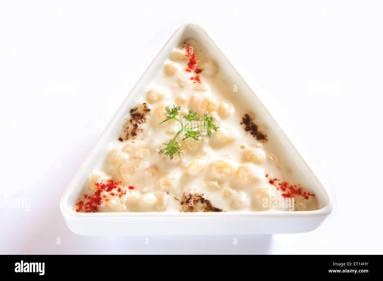 Indian dessert , boondi raita garnish with coriander leaf in rectangle ...