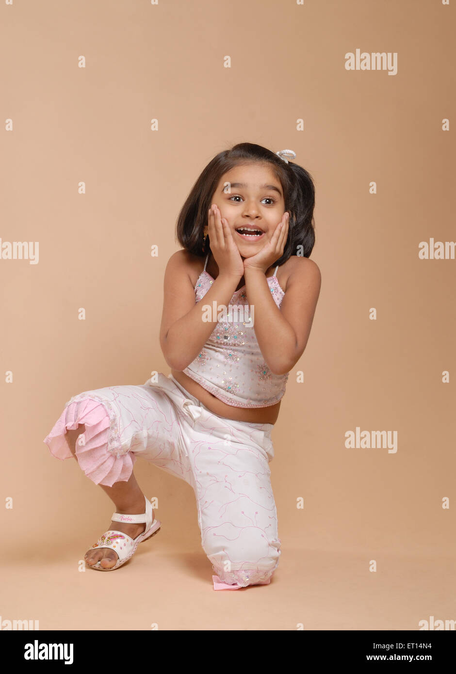 Young girl kept both hand on cheek MR#719D Stock Photo - Alamy
