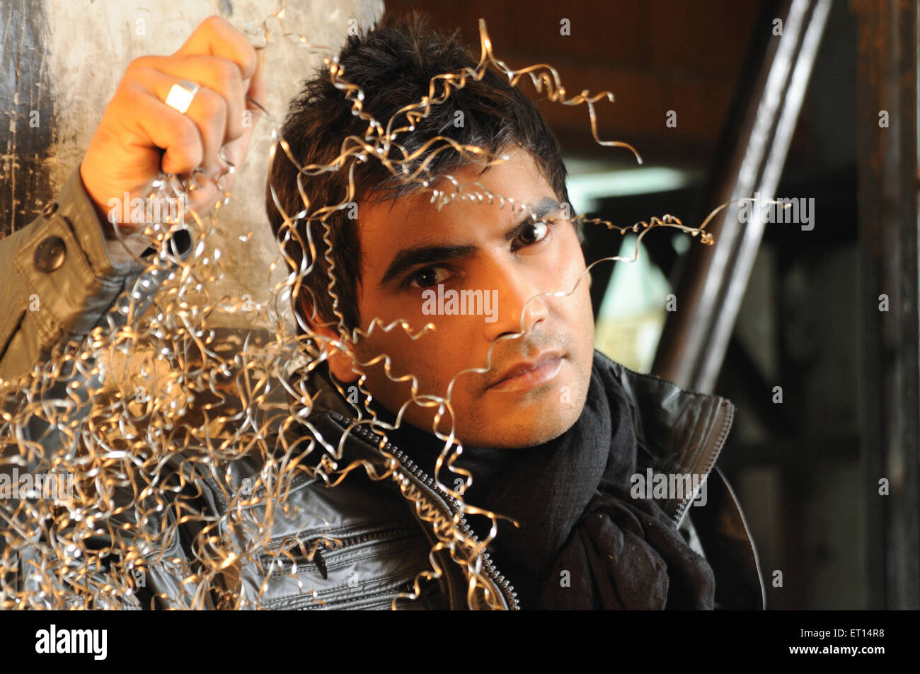 Man holding metal wire MR#719G Stock Photo - Alamy