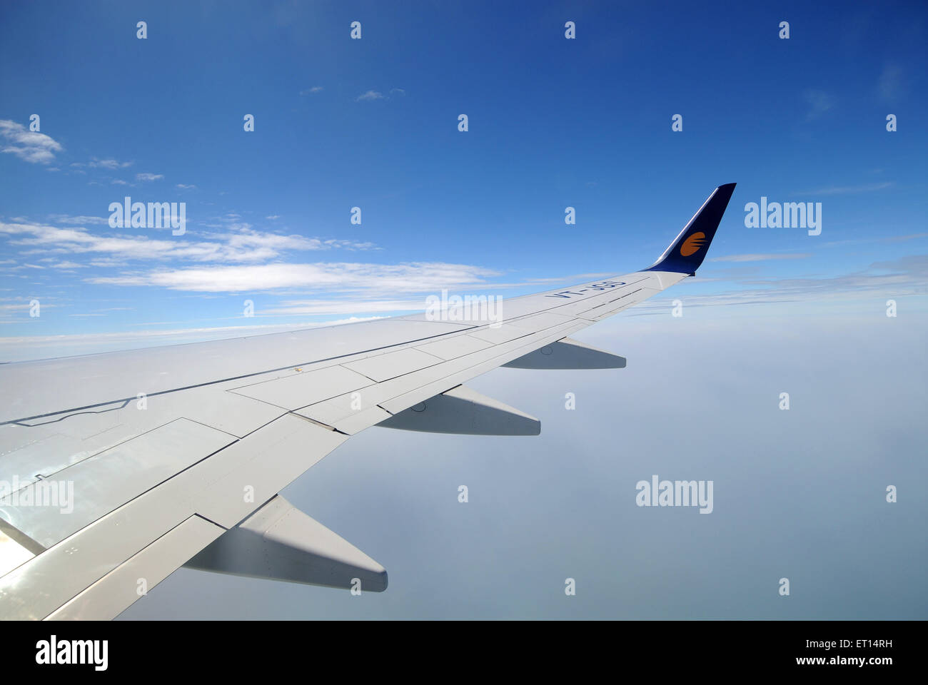 Aerial view of clouds and aircraft wing Stock Photo - Alamy