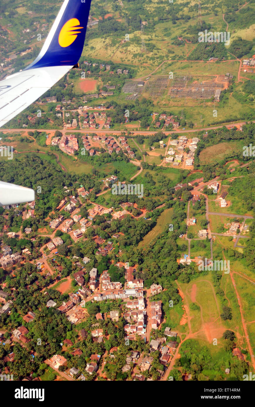 Aerial view of Jet Airways aircraft wing and housing colony, Goa, India ...