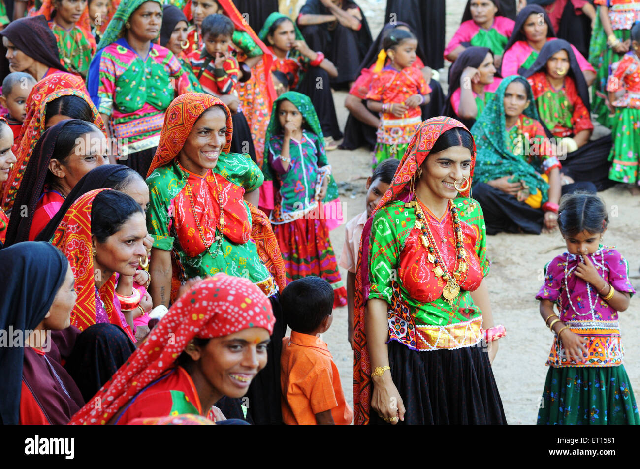 Rural women with children sharing happy moment at Mindiyada near Anjaar ...