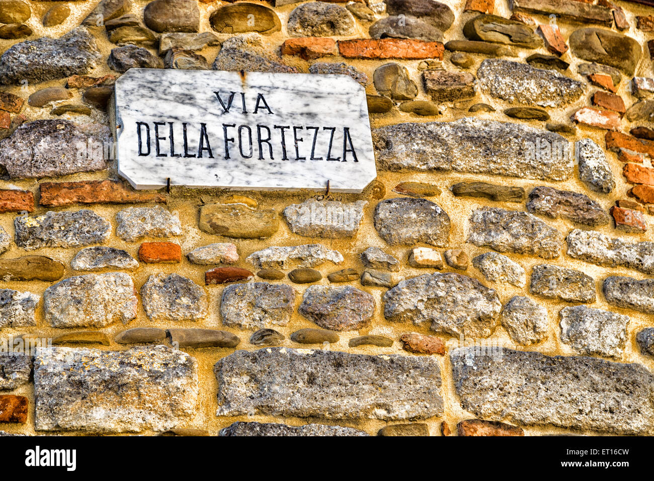 Italian sentence, Via della Fortezza on sign nailed on wall made by ...