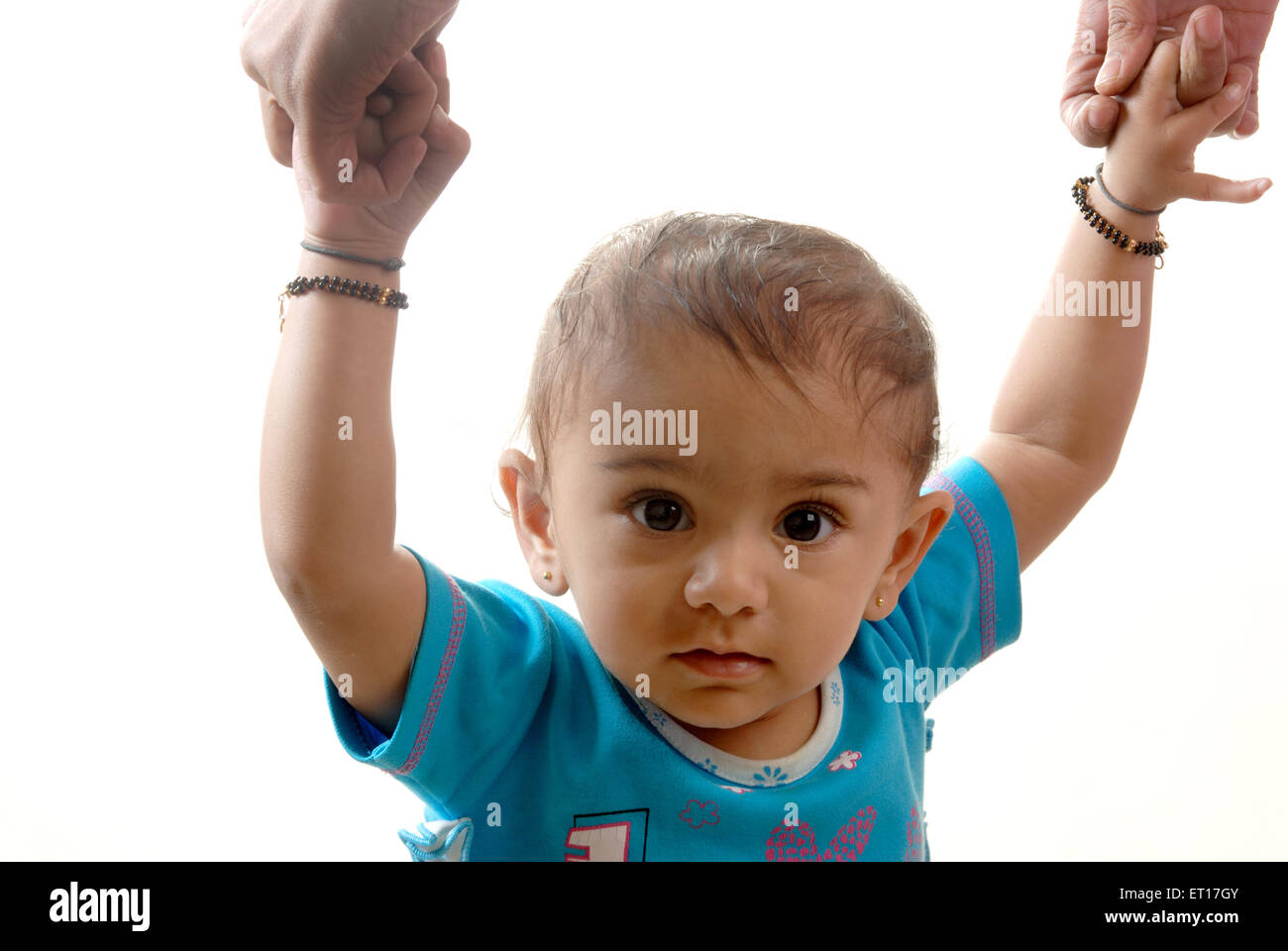 Baby boy learning to walk holding hands MR#152 Stock Photo - Alamy