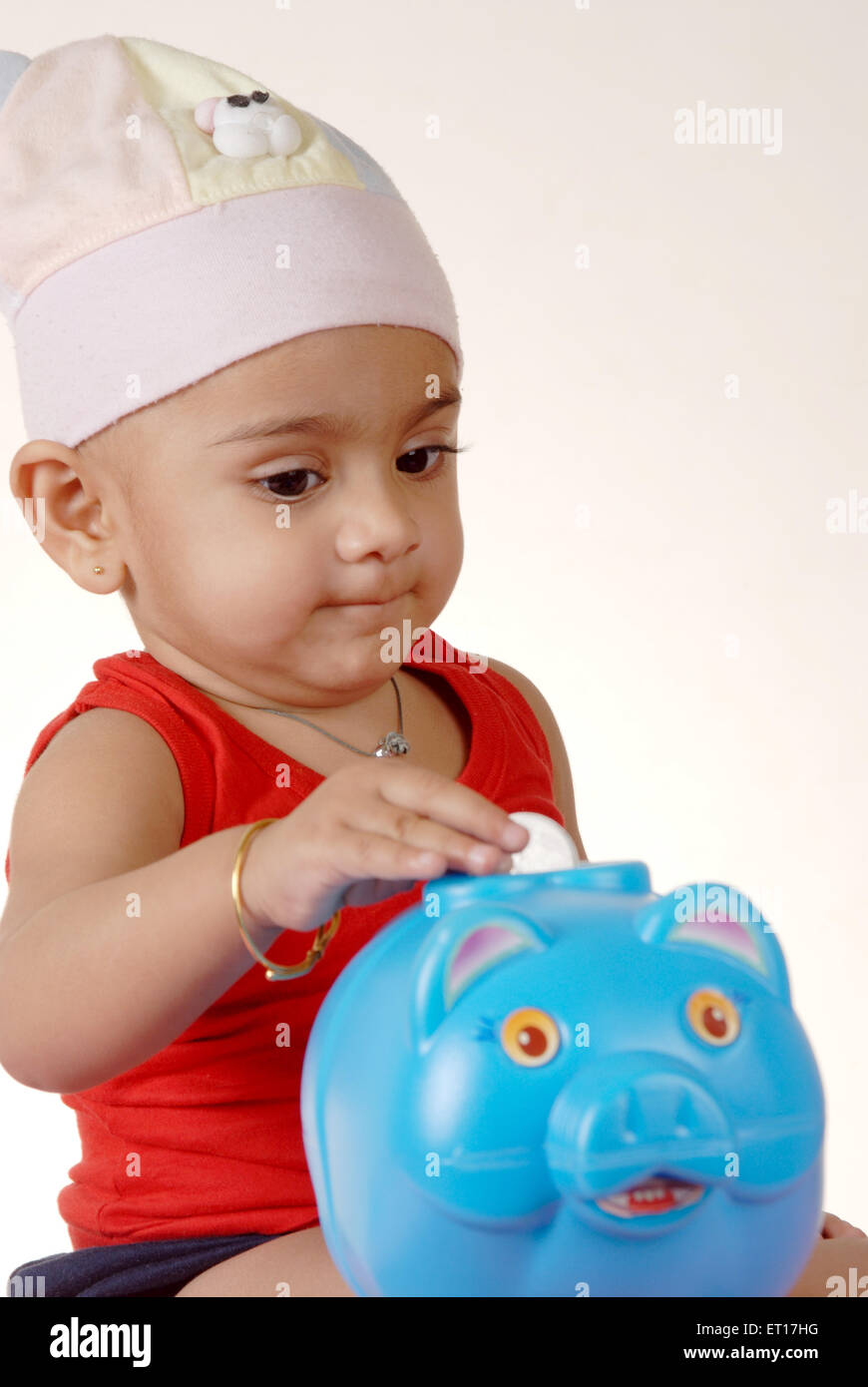 Indian baby boy holding toy hi-res stock photography and images - Alamy
