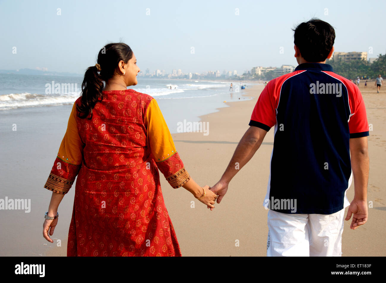 Indian couple holding hands hi-res stock photography and images - Alamy