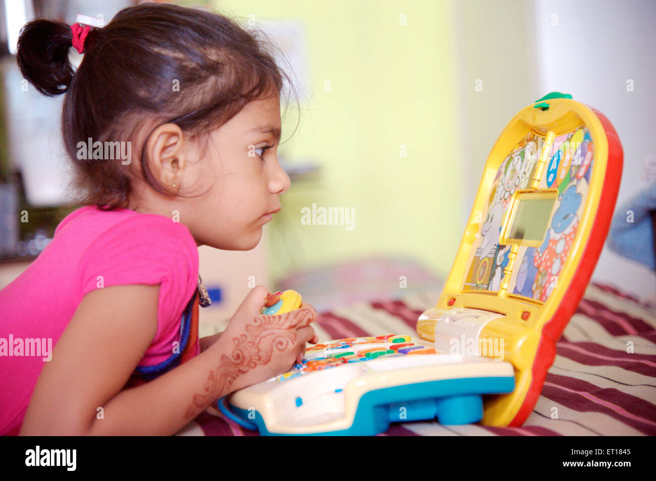 baby girl playing toy computer MR#736L Stock Photo - Alamy