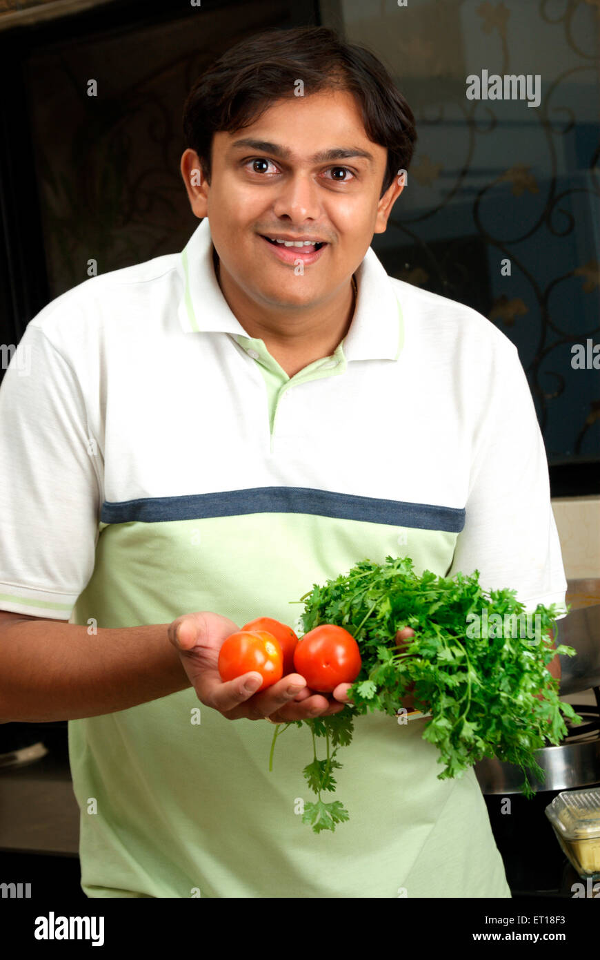 Indian Young Man holding vegetables in hand MR#364 Stock Photo - Alamy