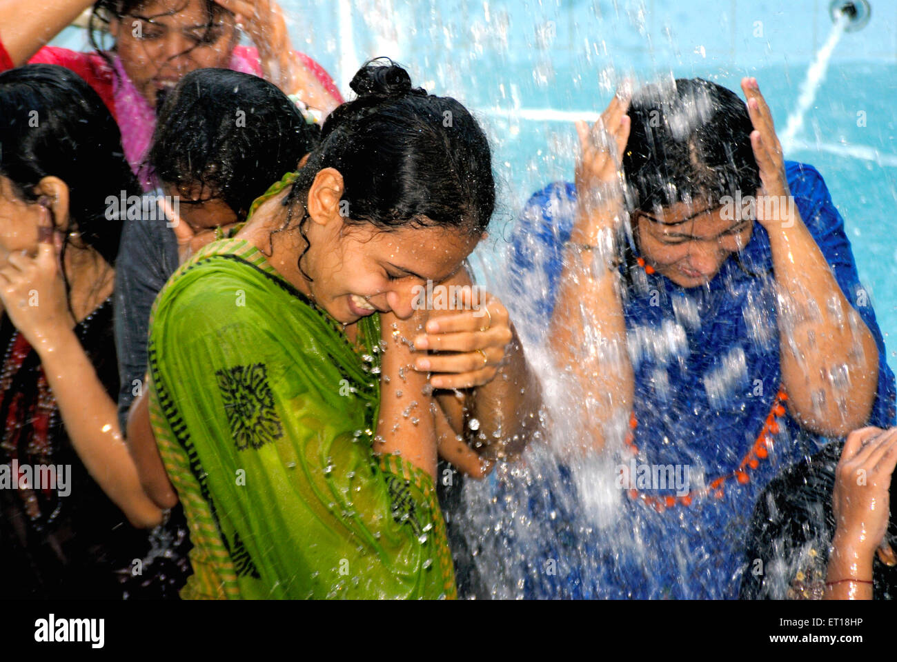 Two indian women bathing in hi-res stock photography and images - Alamy