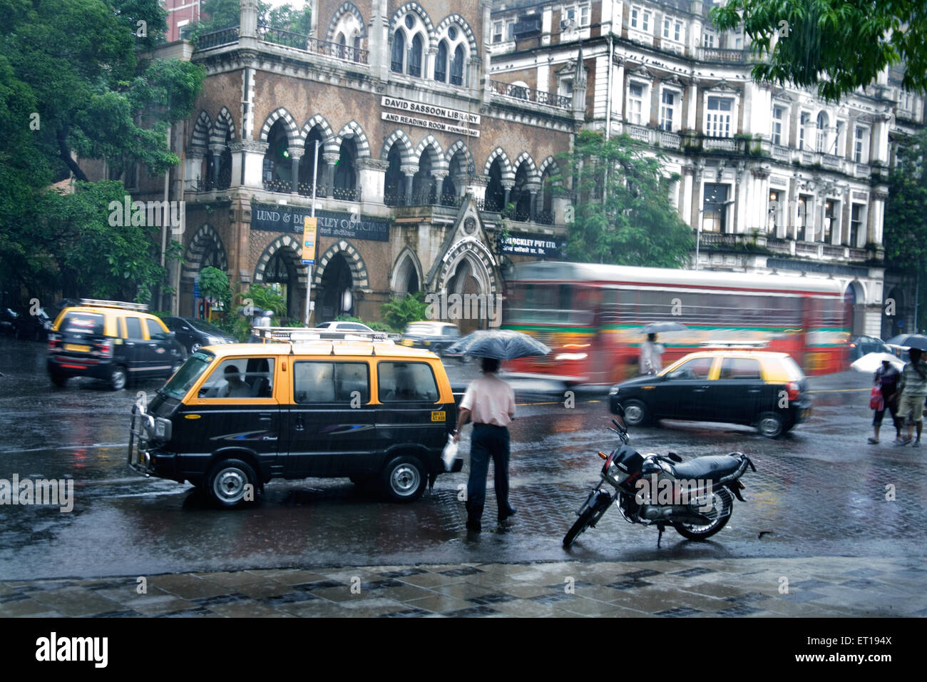 Street scene in monsoon rain ; Bombay Mumbai ; Maharashtra ; India ...