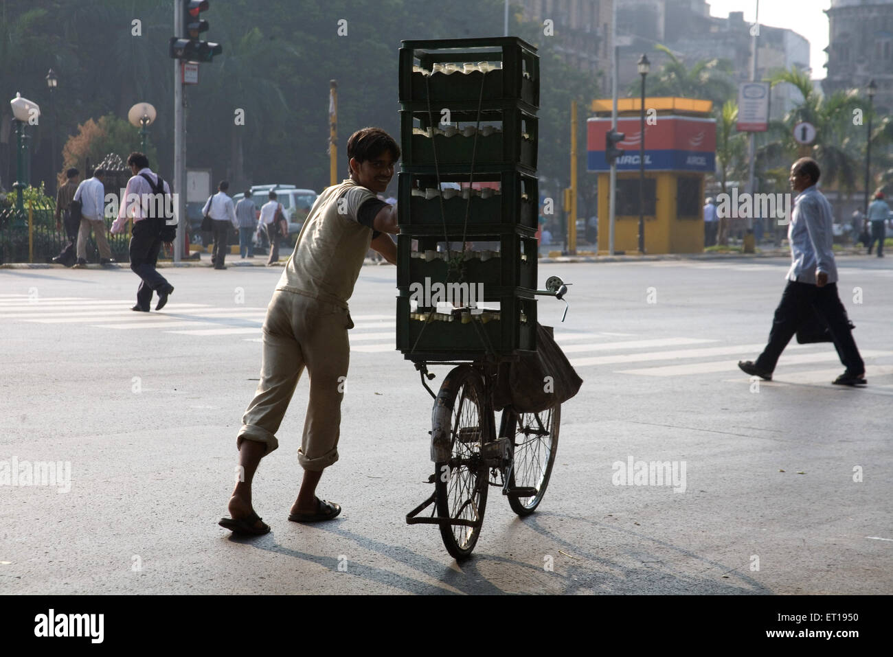 Man carrying racks on cycle ; Bombay Mumbai ; Maharashtra ; India NO MR ...