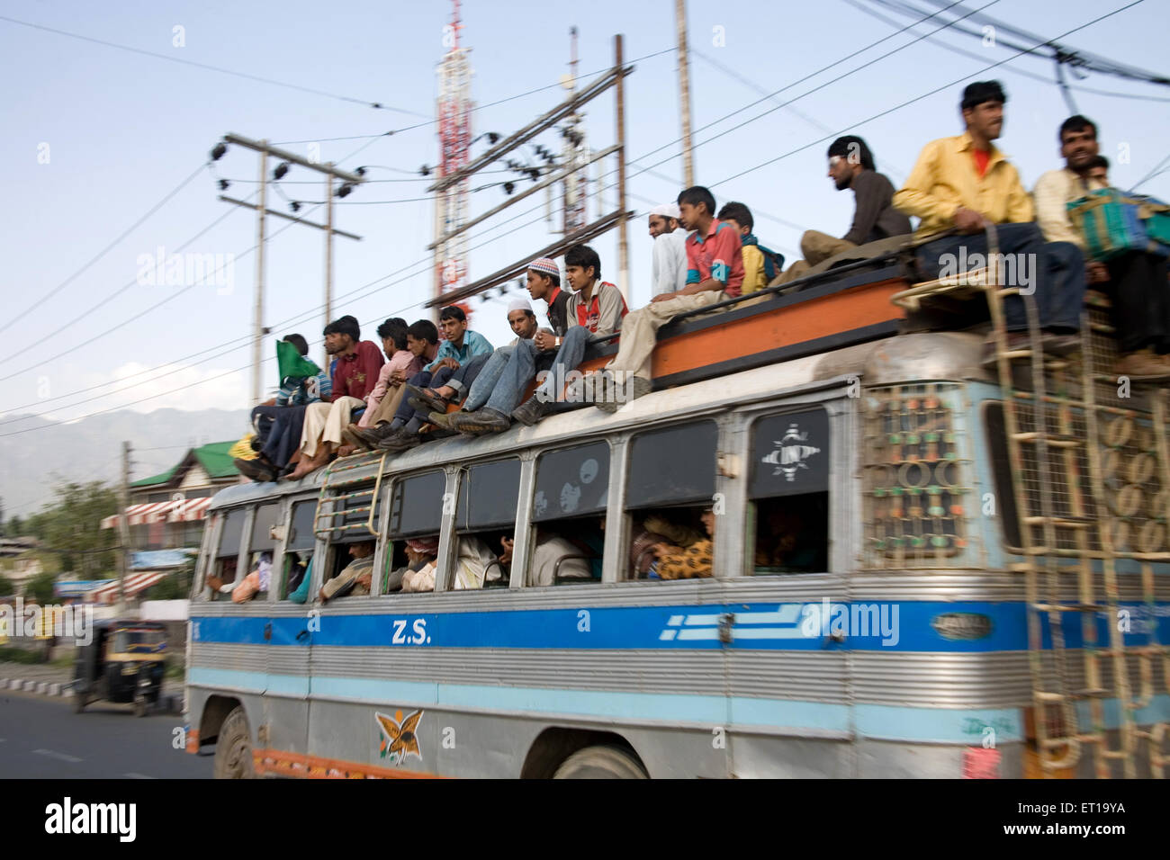 Commuters travelling on roof of bus ; Srinagar ; Jammu and Kashmir ...