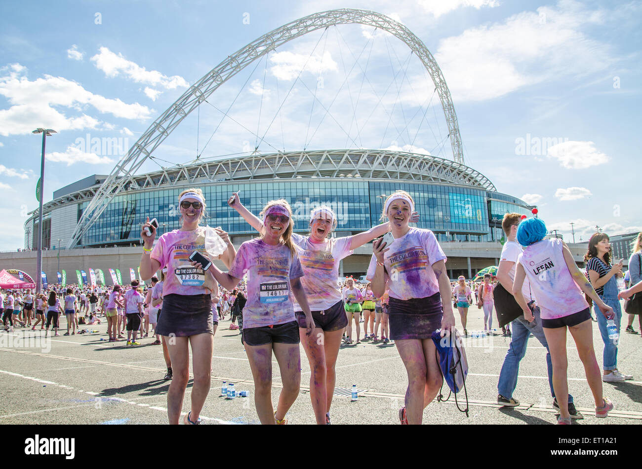 The Color Run at Wembley London. Group of girls having finished the run ...