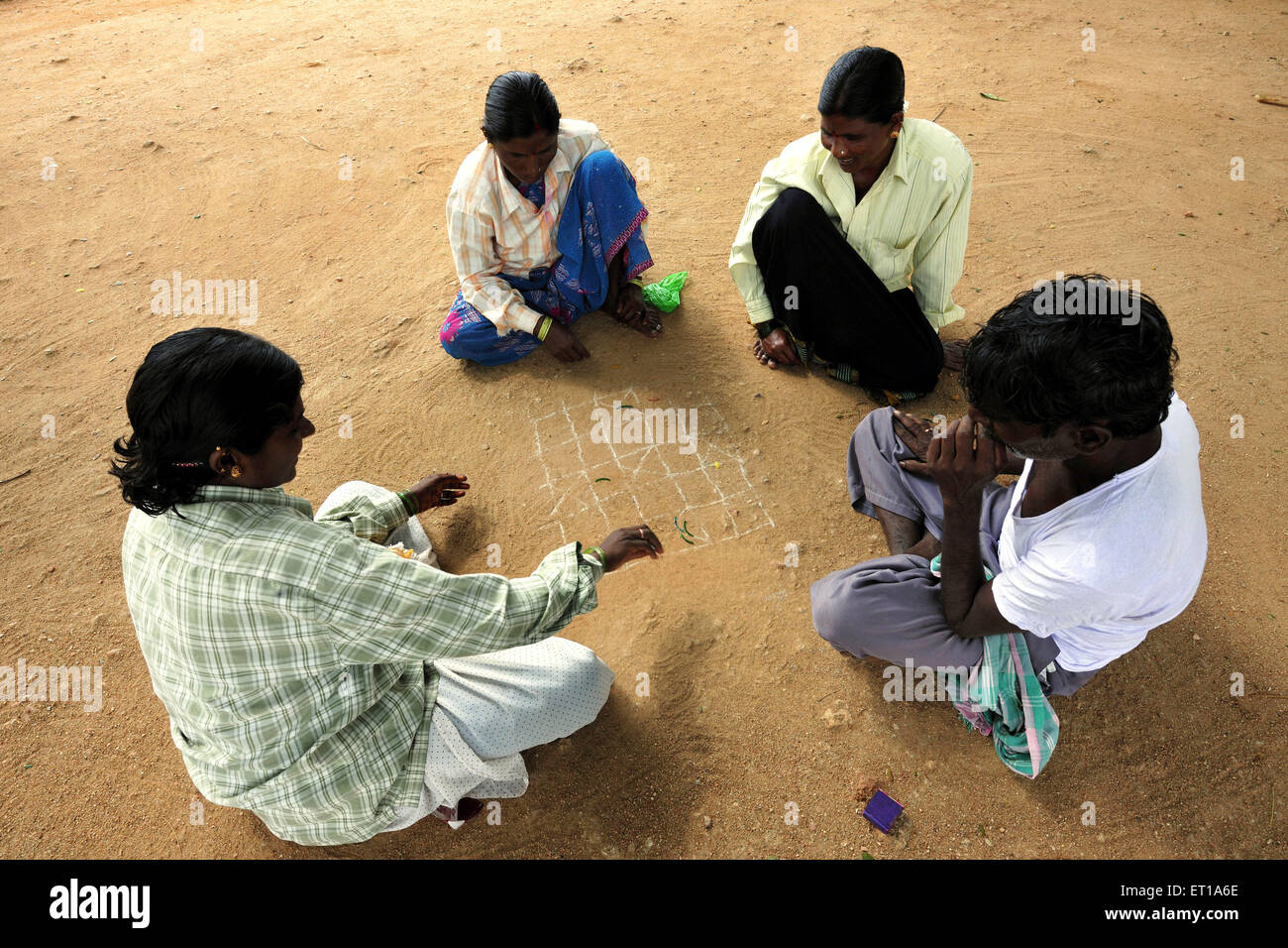 rural people playing board game in sand, Hampi, Karnataka, India, Asia ...