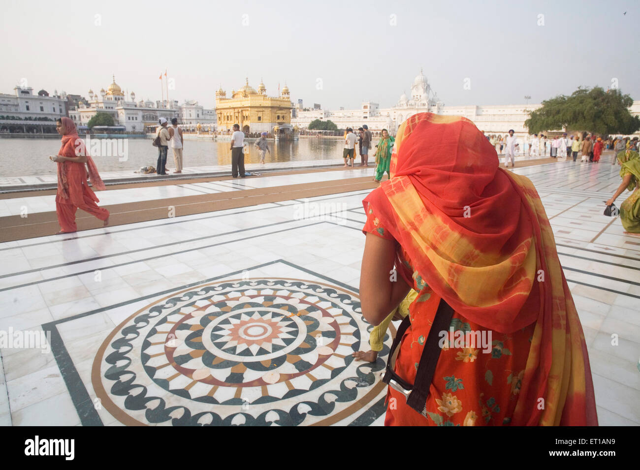 Sikh Devotee bowing down Hari Mandir Sahib and praying ; Marble pattern ...
