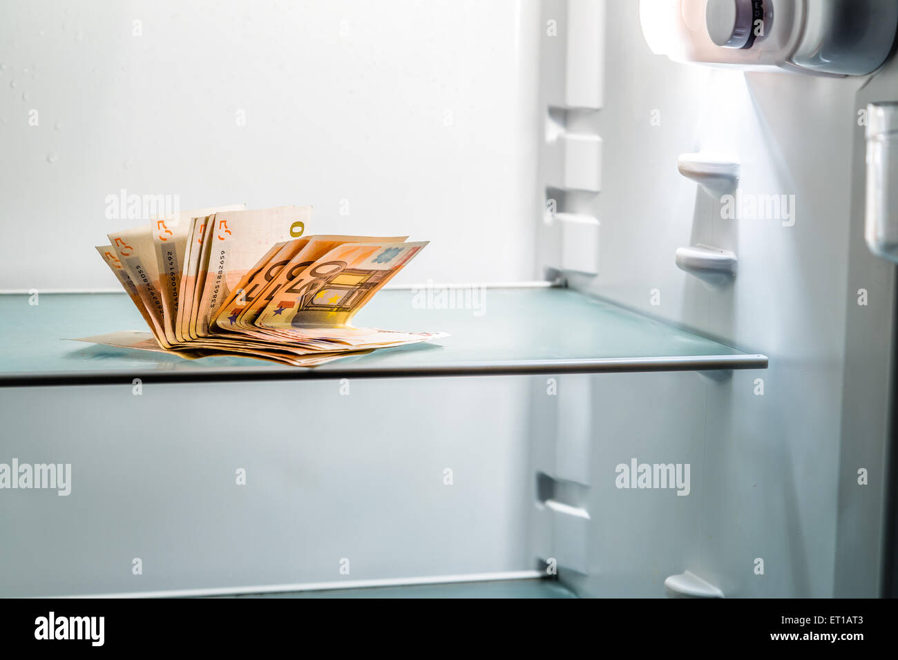 Fresh money in the refrigerator: a handful of 50 euros banknotes ...