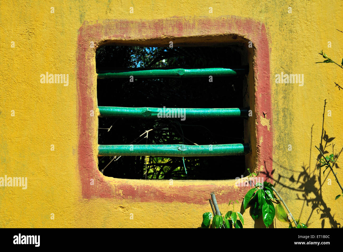 Window with Wooden grill at restaurant compound wall madhya pradesh ...